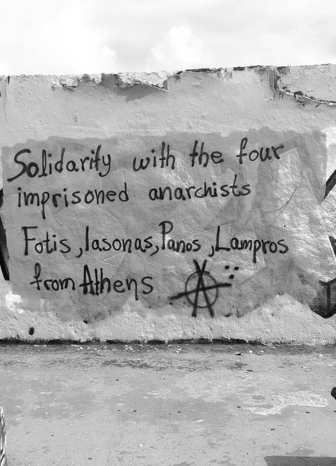 Graffiti slogans in solidarity with the four imprisoned anarchist ...